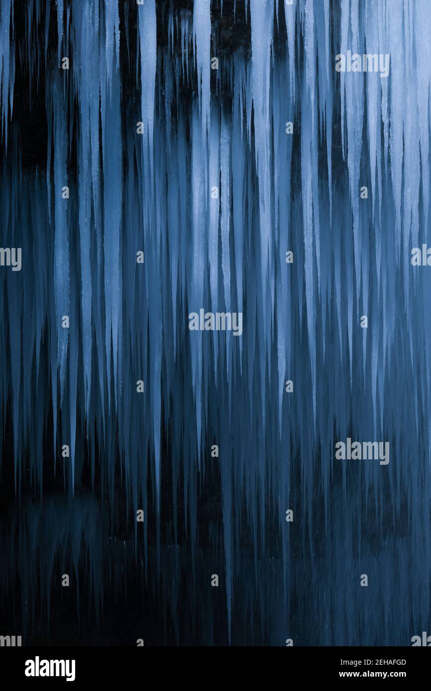 Waterfall crashing down frozen cave hi-res stock photography and images ...