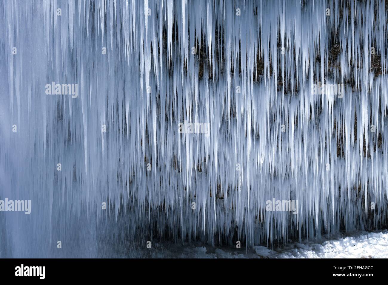 Waterfall crashing down frozen cave hi-res stock photography and images ...