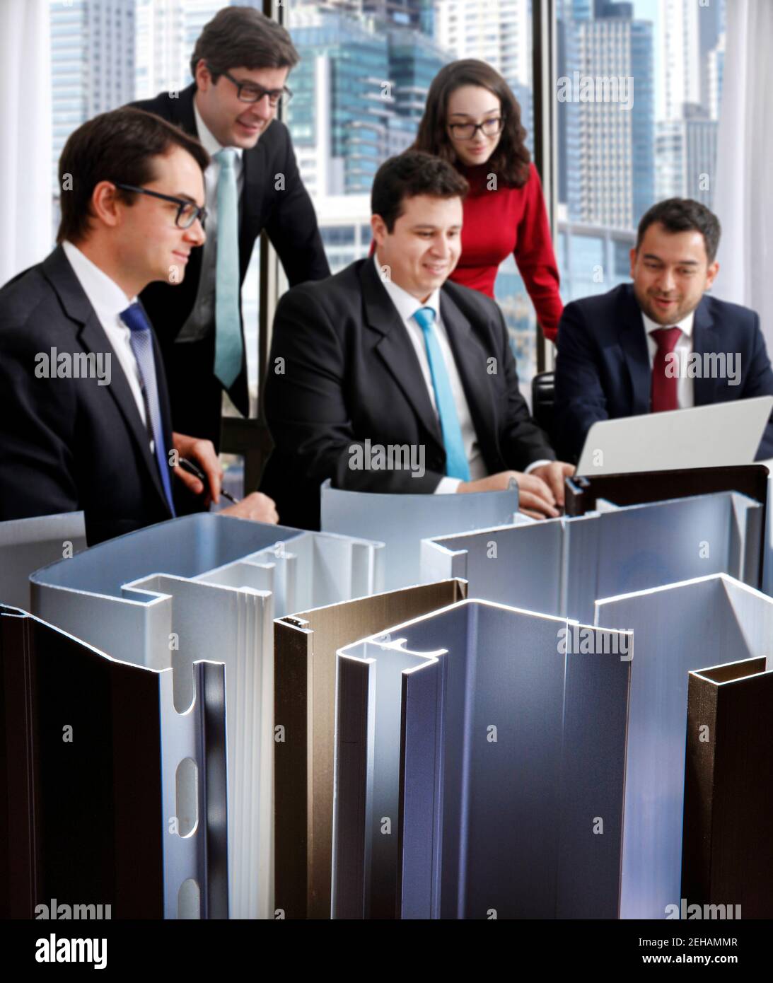 Architects and executives in meeting, building construction using ...