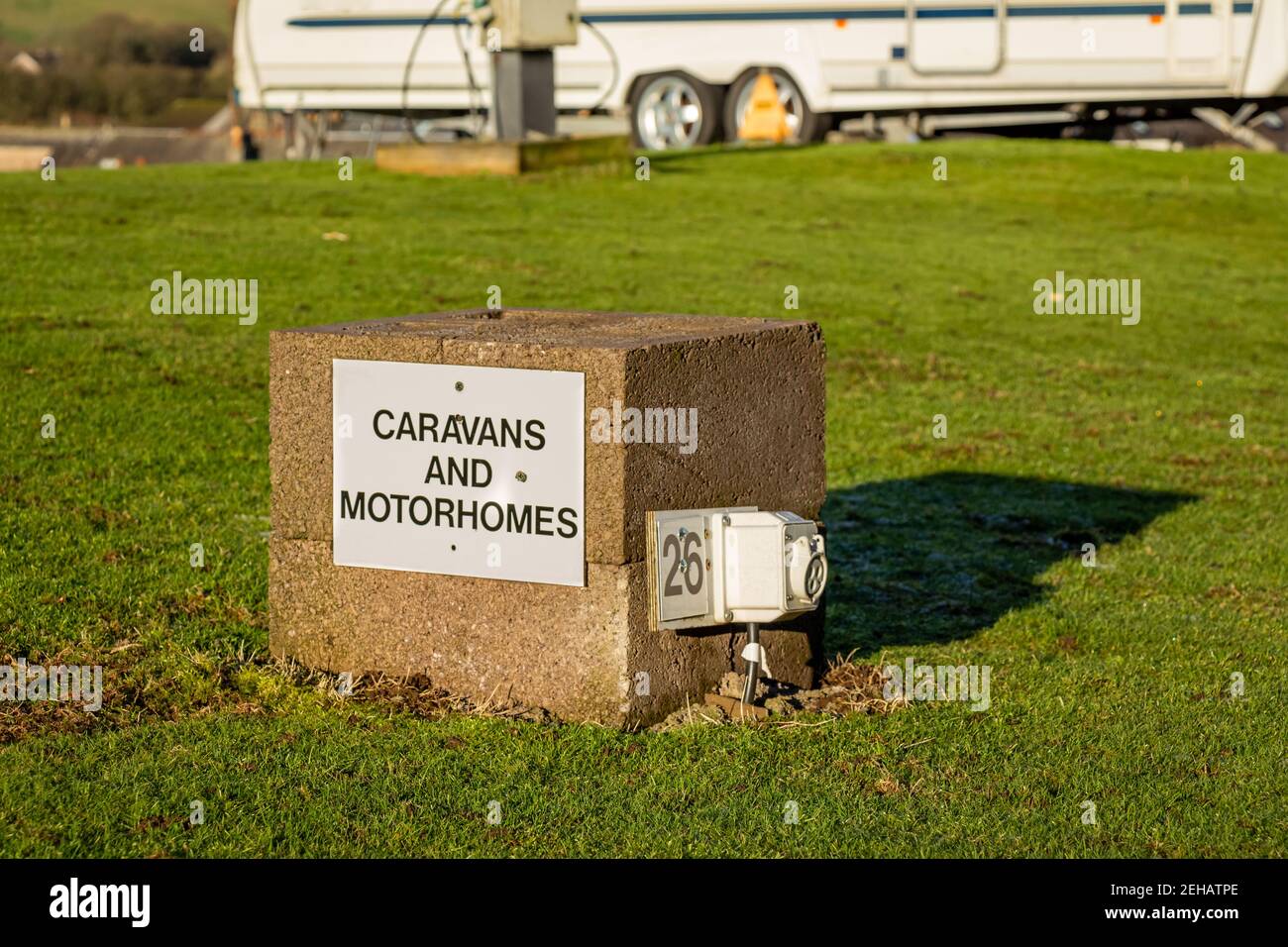 Caravan, motor homes and RV electrical power hook up plug on a site in ...