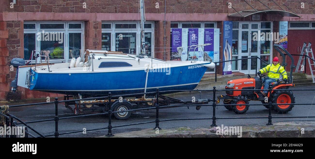 Hunter Medina Yacht being towed by tractor, for care-in to harbour ...