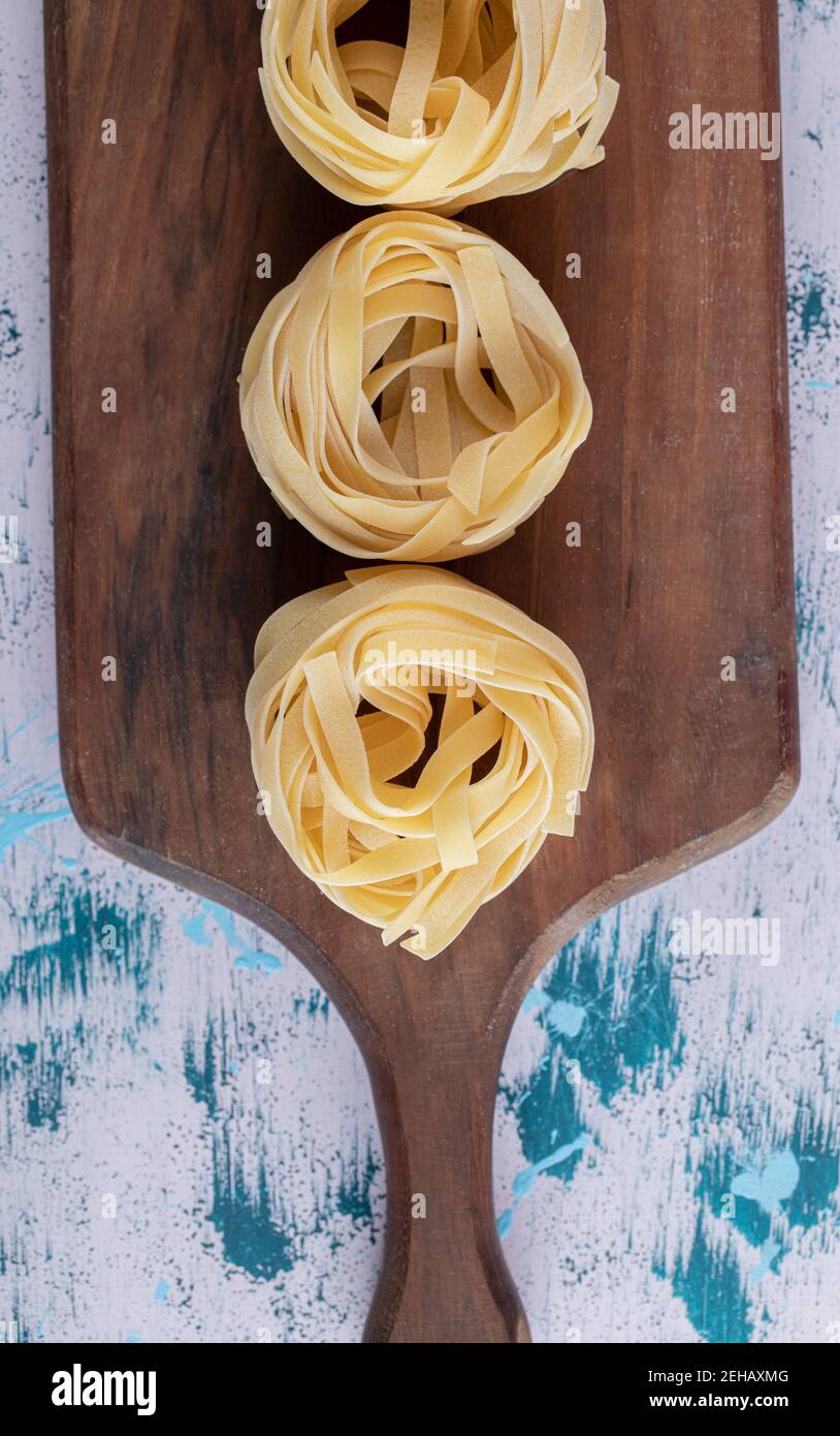 Raw tagliatelle pasta on cutting hi-res stock photography and images ...