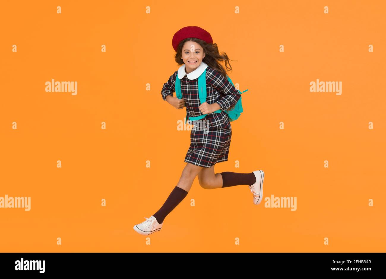 small girl running to school, study education Stock Photo - Alamy