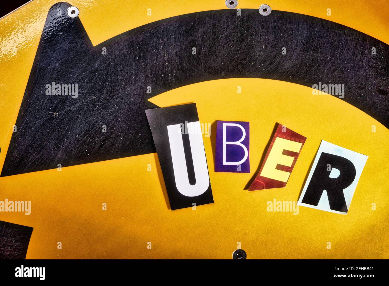 The word "Uber" using cut-out paper letters in the ransom note effect ...