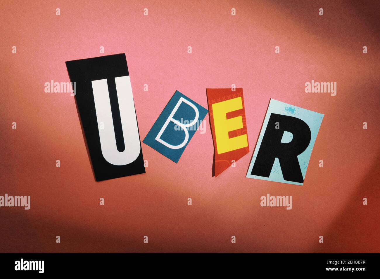 The word "Uber" using cut-out paper letters in the ransom note effect ...