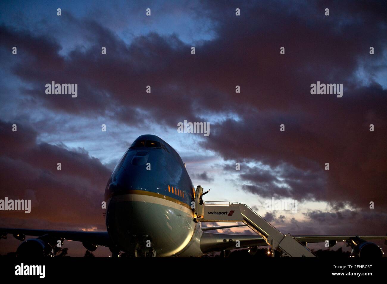 President Barack Obama waves as he boards Air Force One at John F ...
