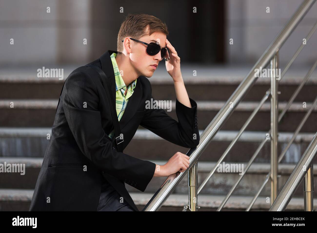 Man leaning on railing hi-res stock photography and images - Alamy