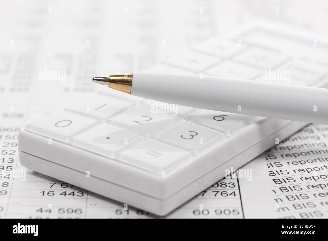 Financial accounting Pen and calculator on balance sheets Stock Photo ...