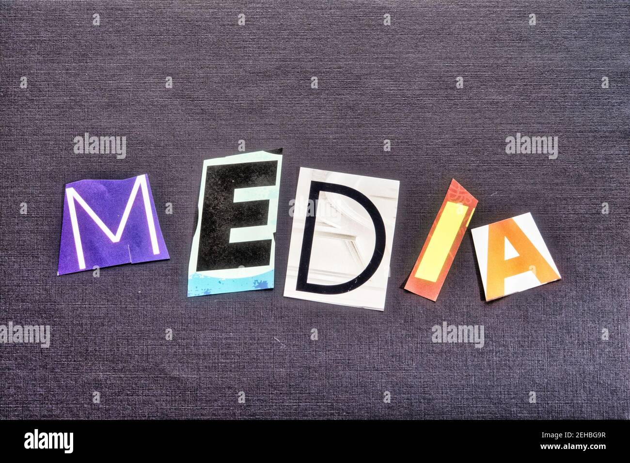 The word "MEDIA" using cut-out paper letters in the ransom note effect ...