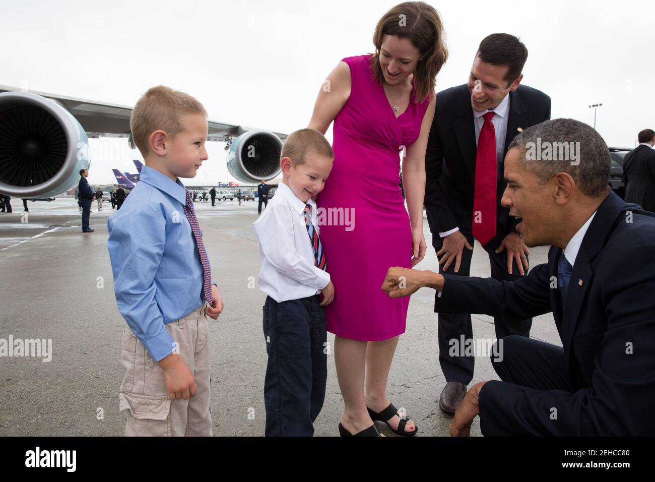 President Barack Obama greets Jeff and Megan Guttman, along with their ...