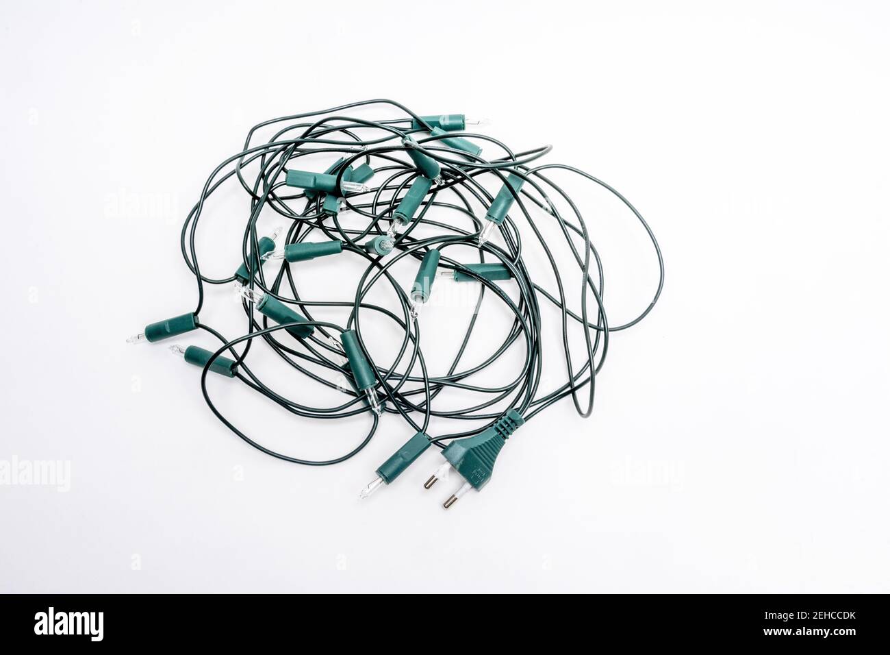 Closeup shot of a pile of messy tangled Christmas lights isolated on a ...