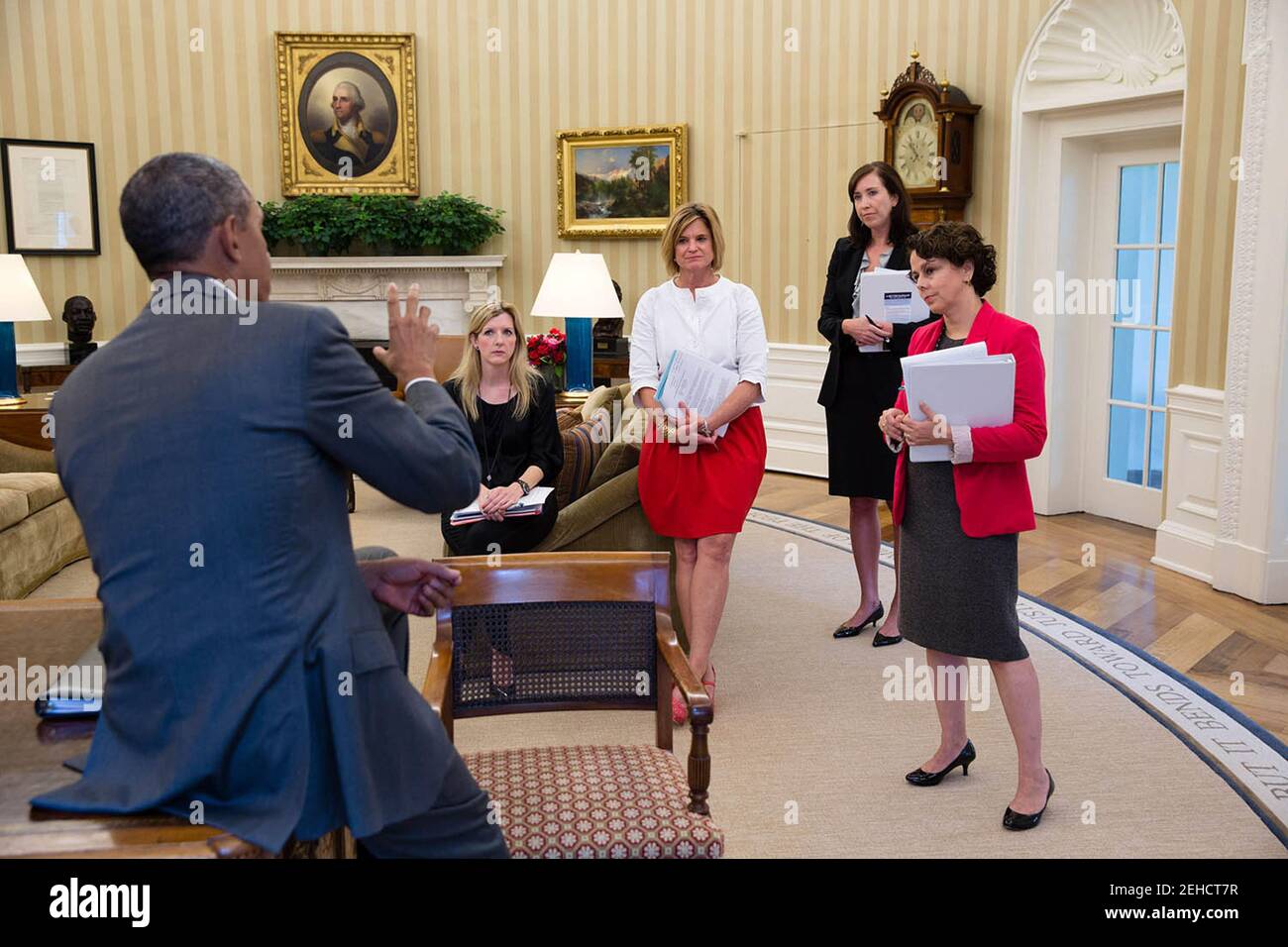 President Barack Obama prepares for a meeting with economic columnists ...