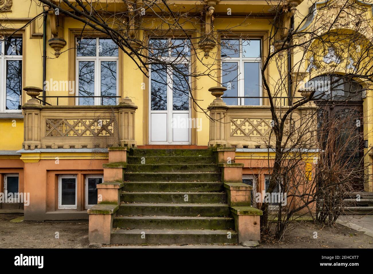 Facade of renovated tenement house with old stairs and terrace Stock ...
