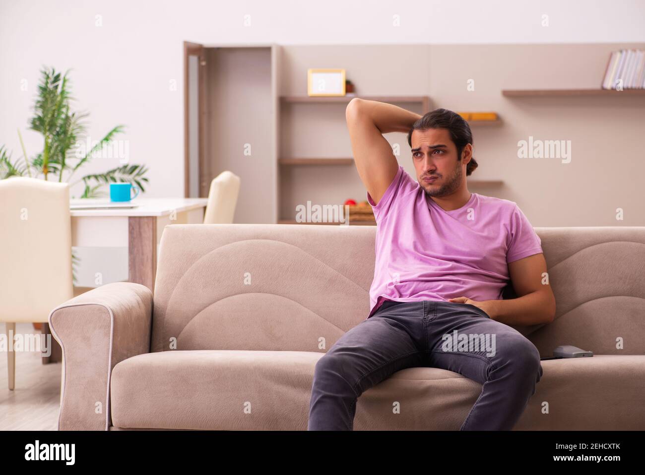 Man staying at home during pandemic Stock Photo - Alamy