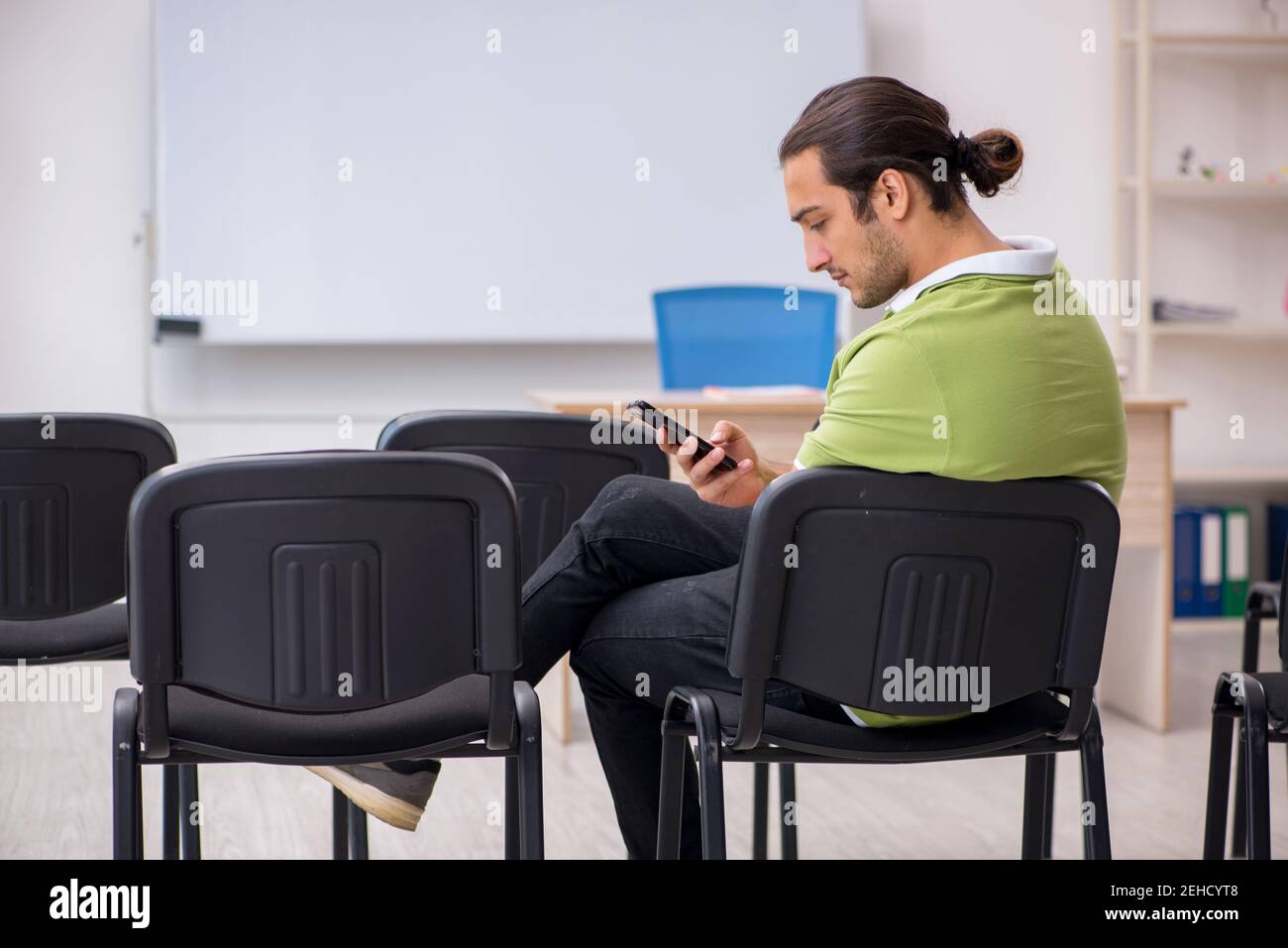 Young student in business presentation concept Stock Photo - Alamy