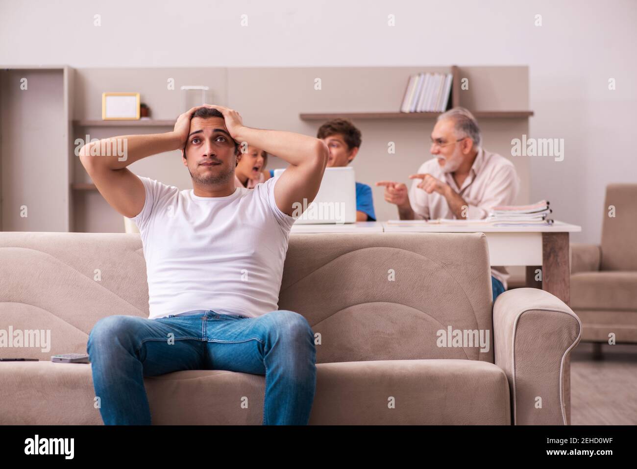 Three generations at home in early development concept Stock Photo - Alamy