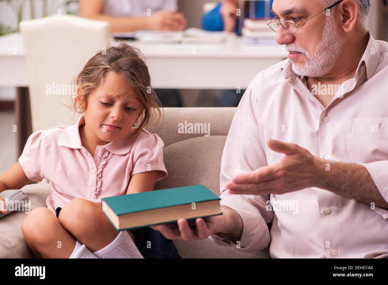 Three generations at home in early development concept Stock Photo - Alamy