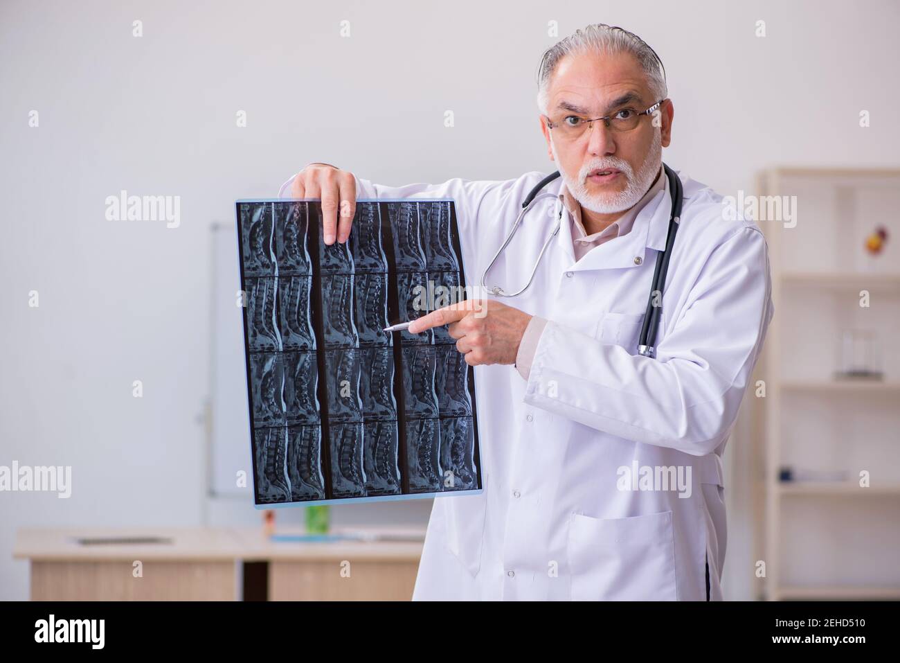 Old doctor radiologist working in the clinic Stock Photo - Alamy
