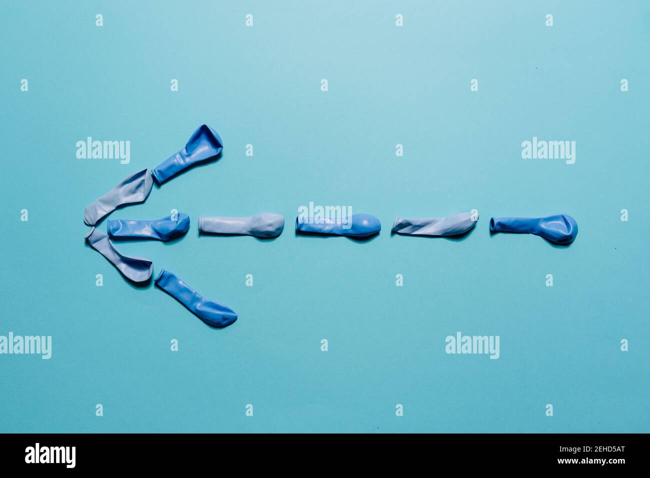 Top view of arrow sign made of air balloons representing direction and ...