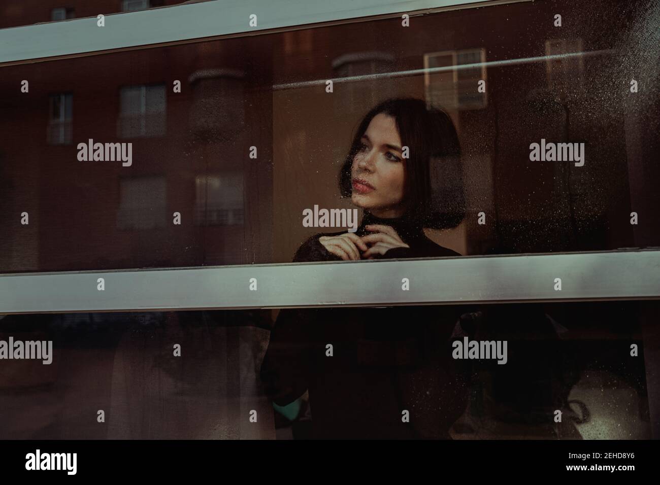 Side view of unrecognizable male observing art object in shape of iron ...