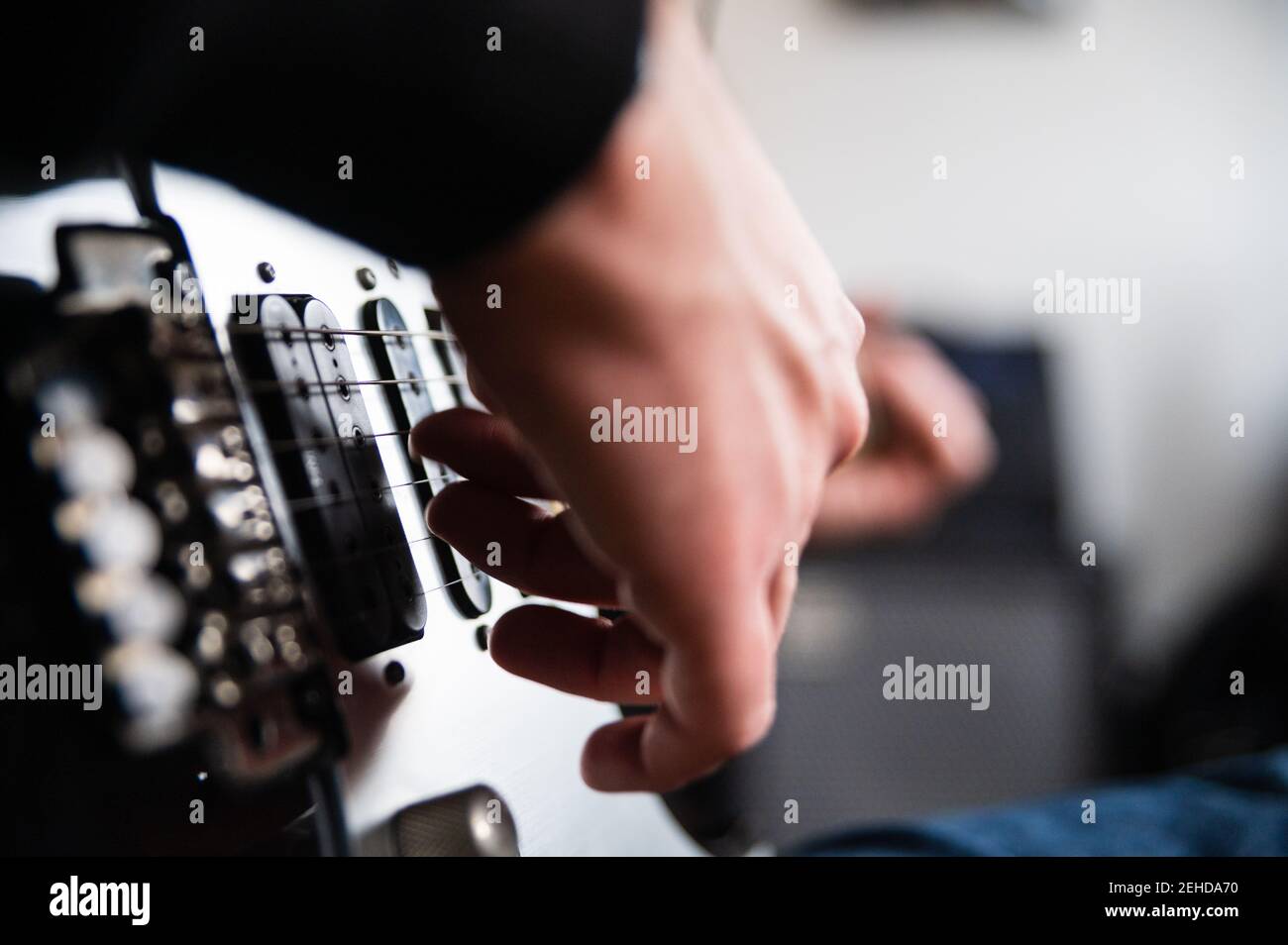 Low angle side view of concentrated blind guitarist playing music ...