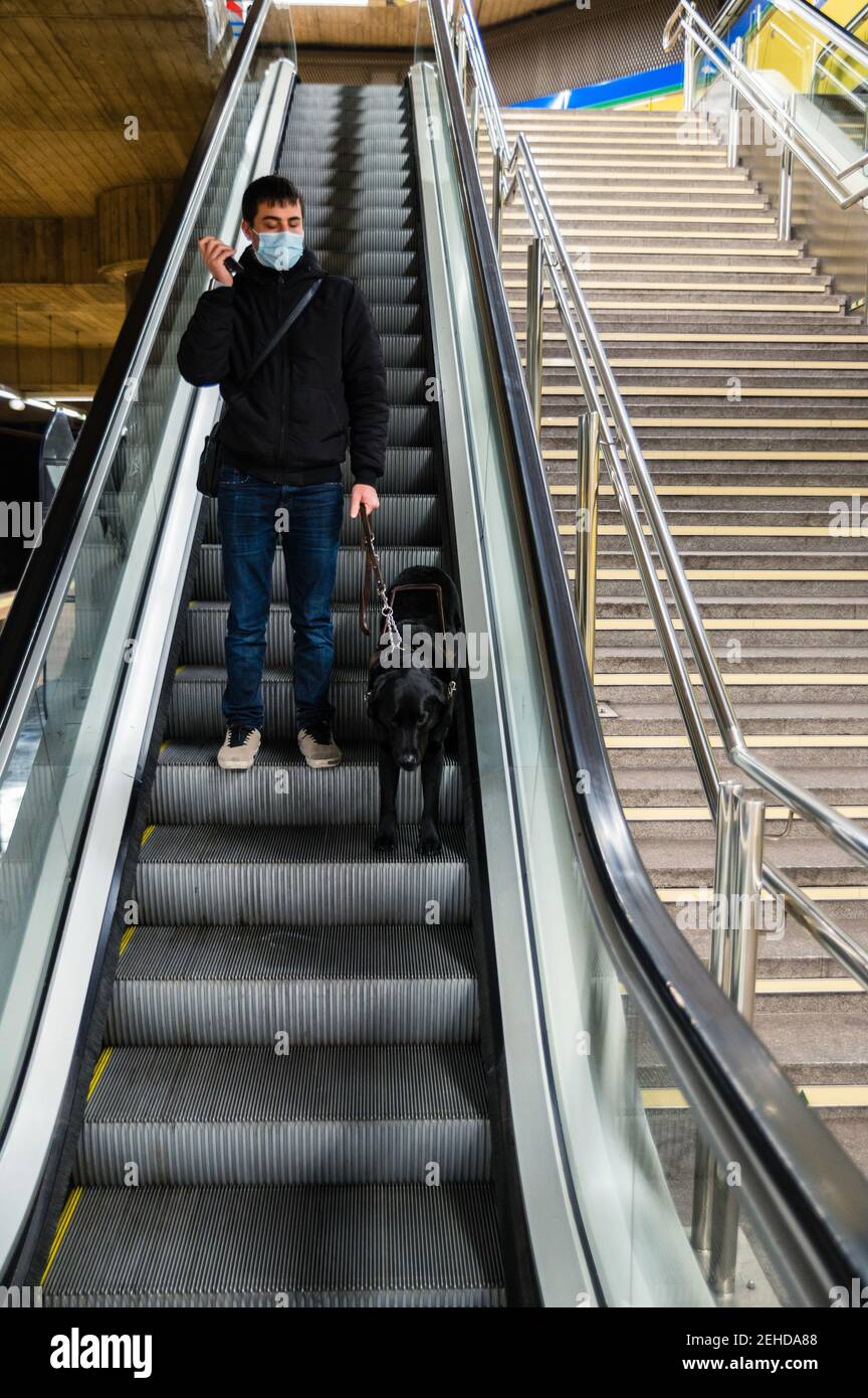 Full body of male in mask with eyesight disability standing on ...