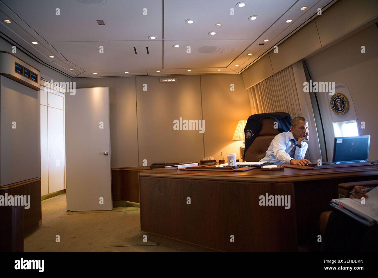 President Barack Obama works at his computer aboard Air Force One ...