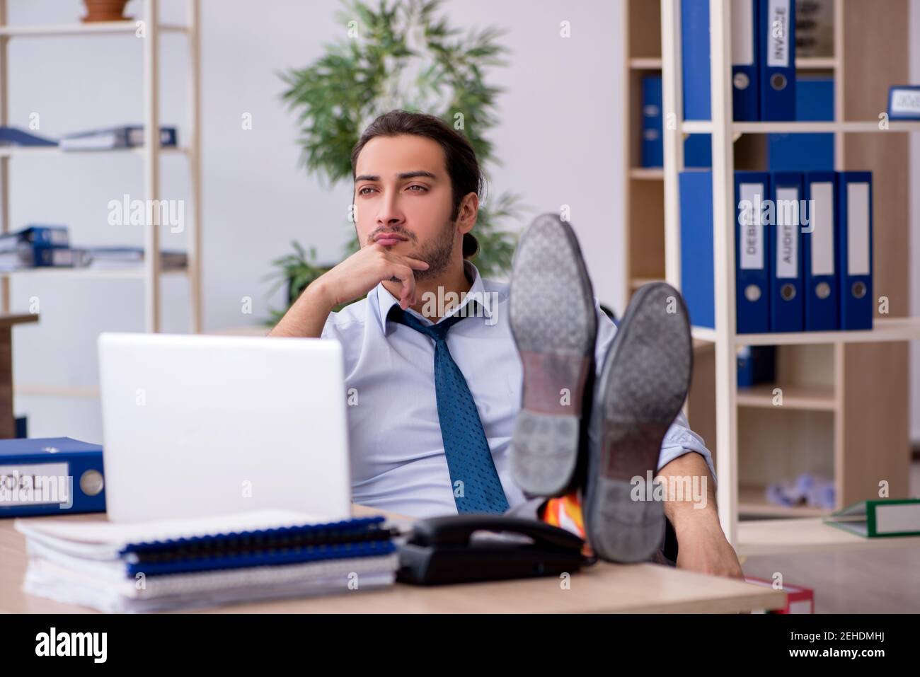 Young bookkeeper working in the office Stock Photo - Alamy