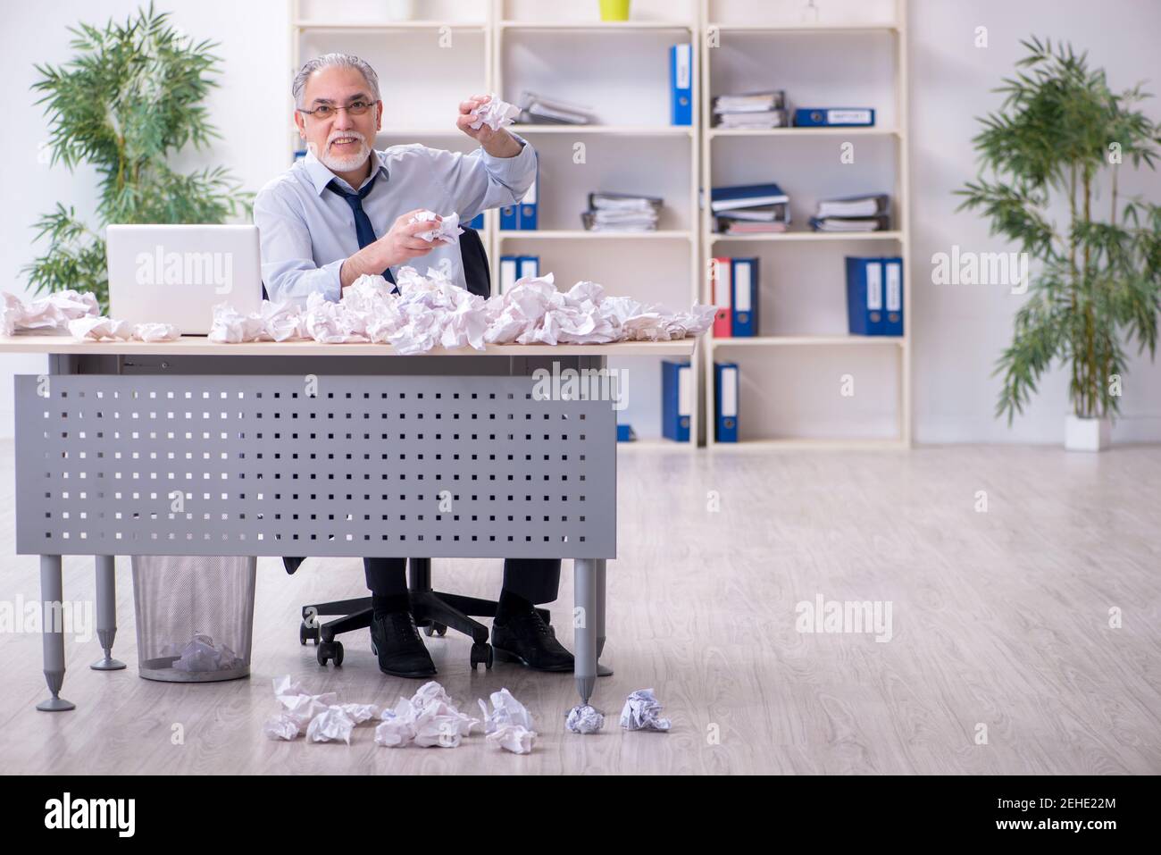 Old businessman rejecting ideas with lots of papers Stock Photo - Alamy