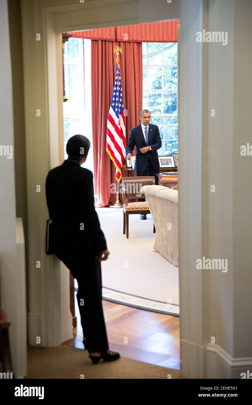 President Barack Obama speaks with National Security Advisor Susan E ...