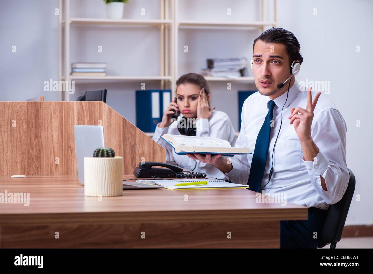 The call center operators working in the office Stock Photo - Alamy