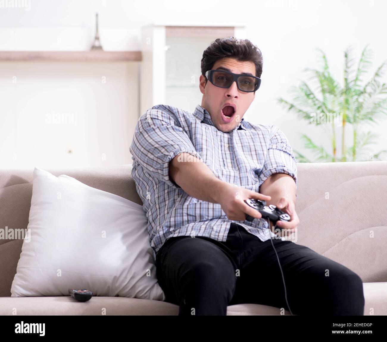 The man playing 3d games at home Stock Photo - Alamy