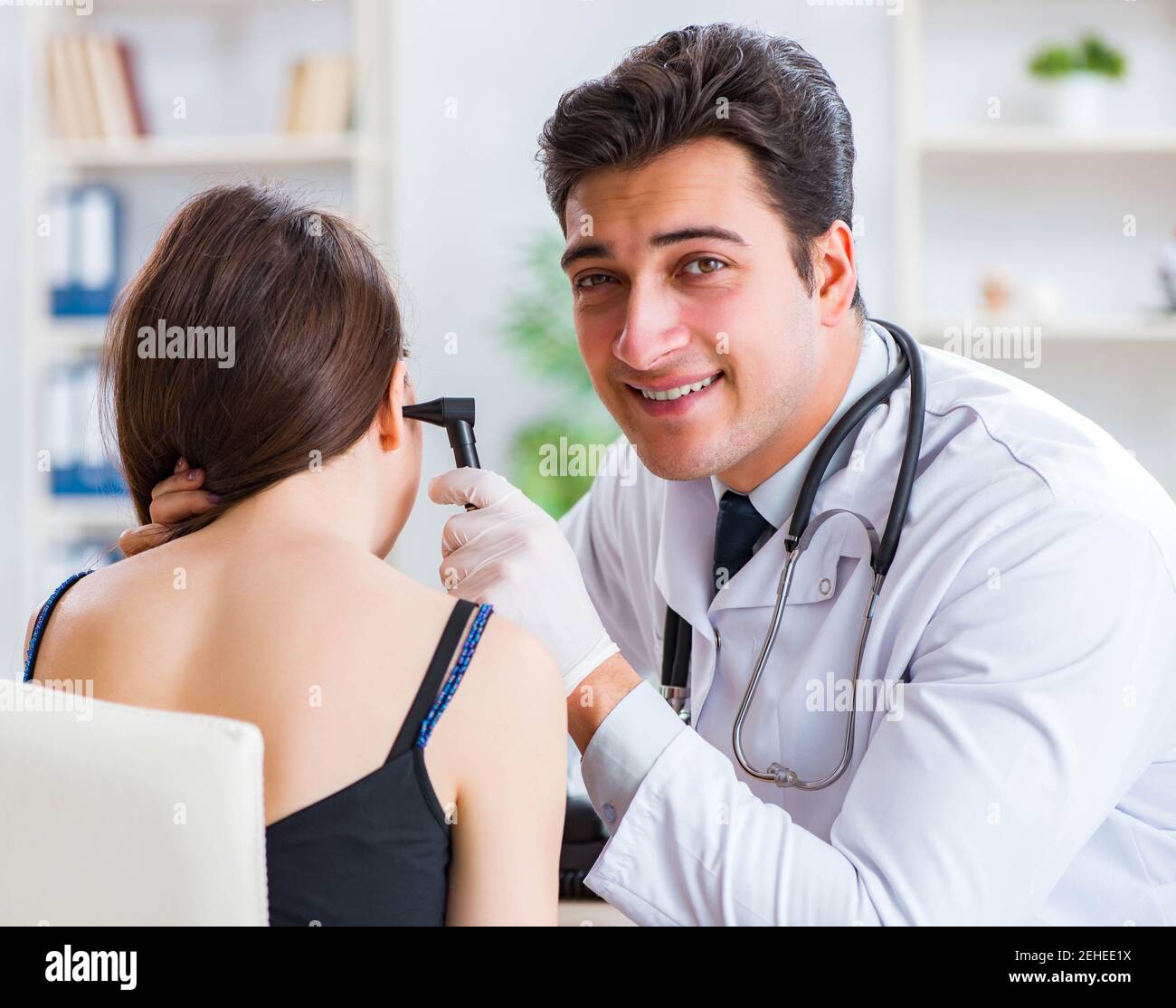 The doctor checking patients ear during medical examination Stock Photo ...