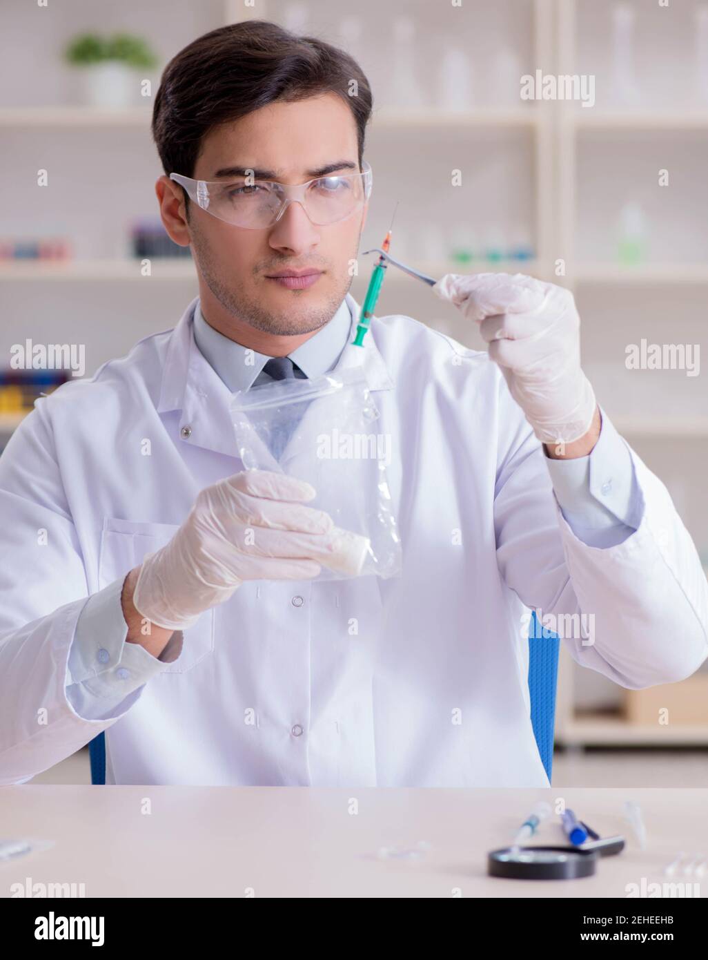 The expert criminologist working in the lab for evidence Stock Photo ...