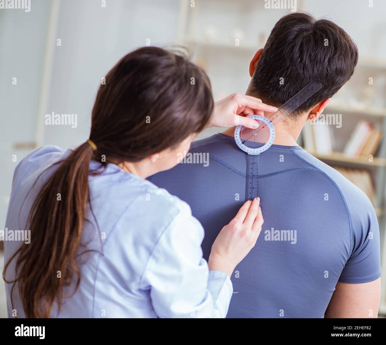 The doctor checking patients joint flexibility with gonimeter Stock ...