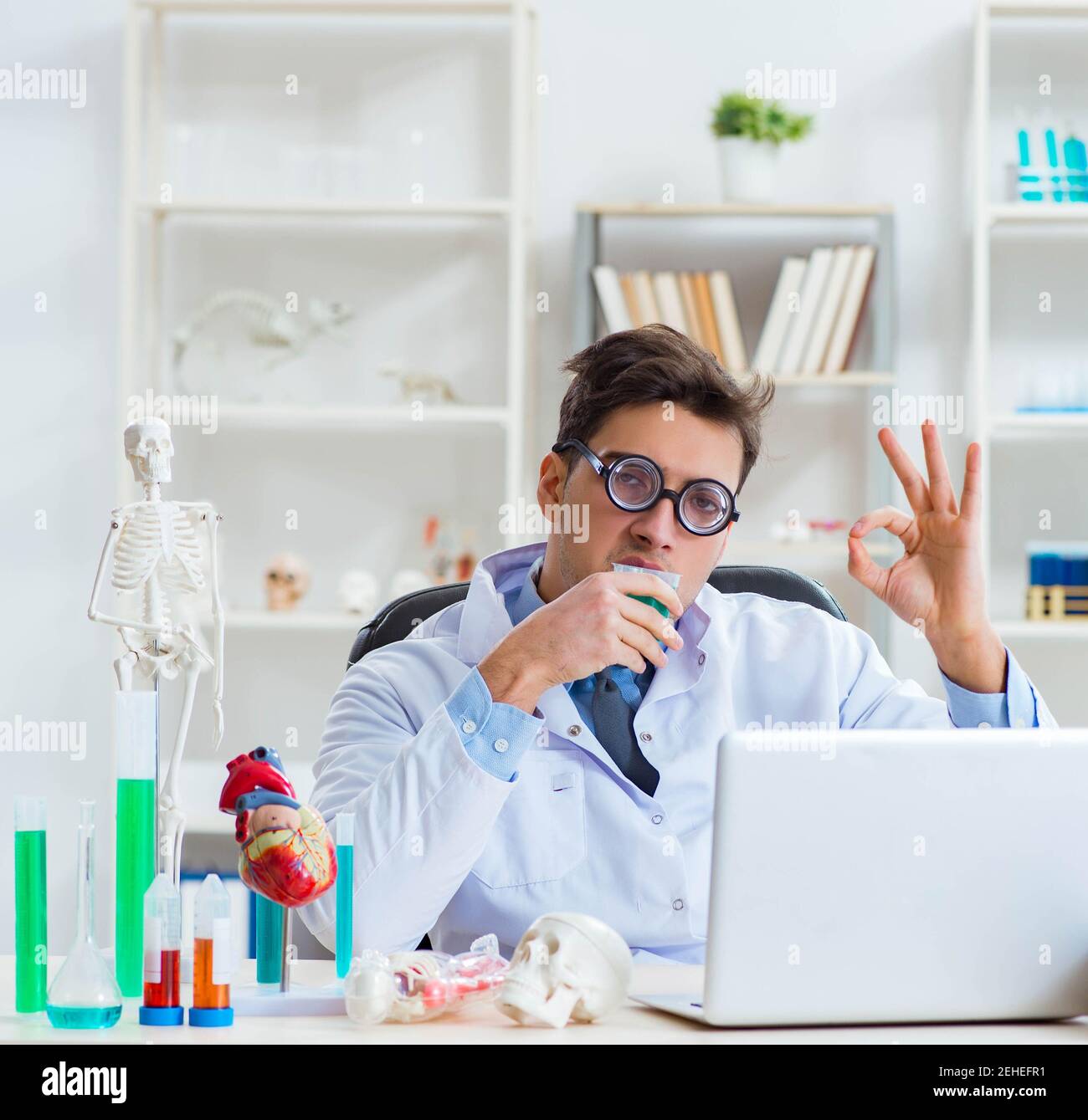The funny doctor having fun in hospital lab Stock Photo - Alamy