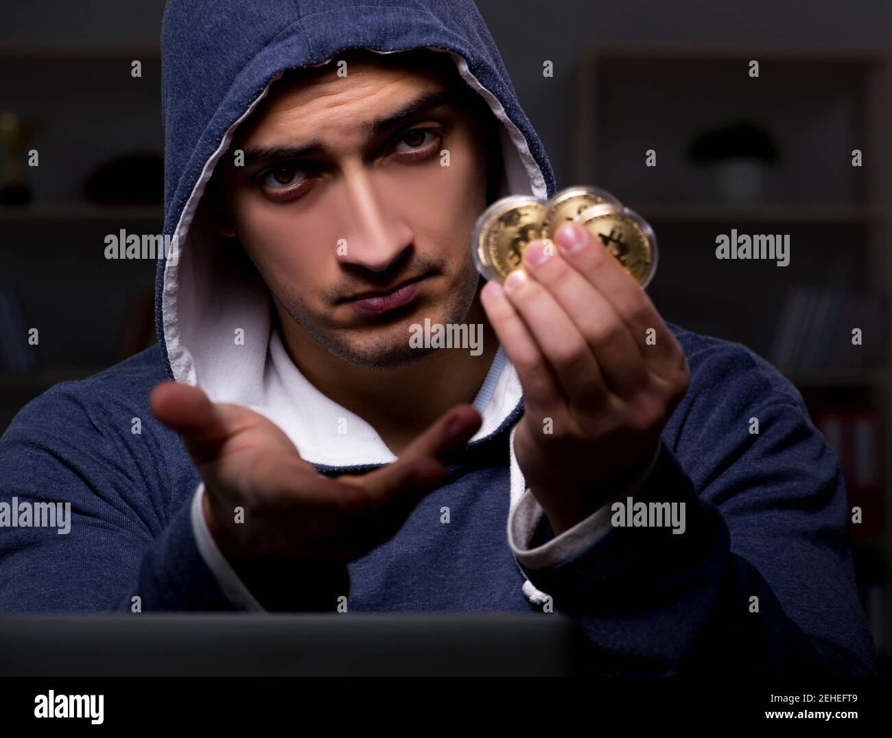 The young man in bitcoin mining concept Stock Photo - Alamy