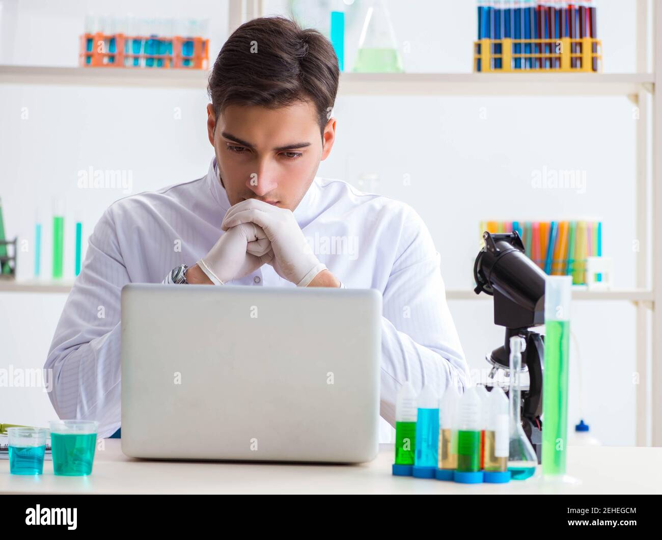 The man student working in chemical lab on experiment Stock Photo - Alamy