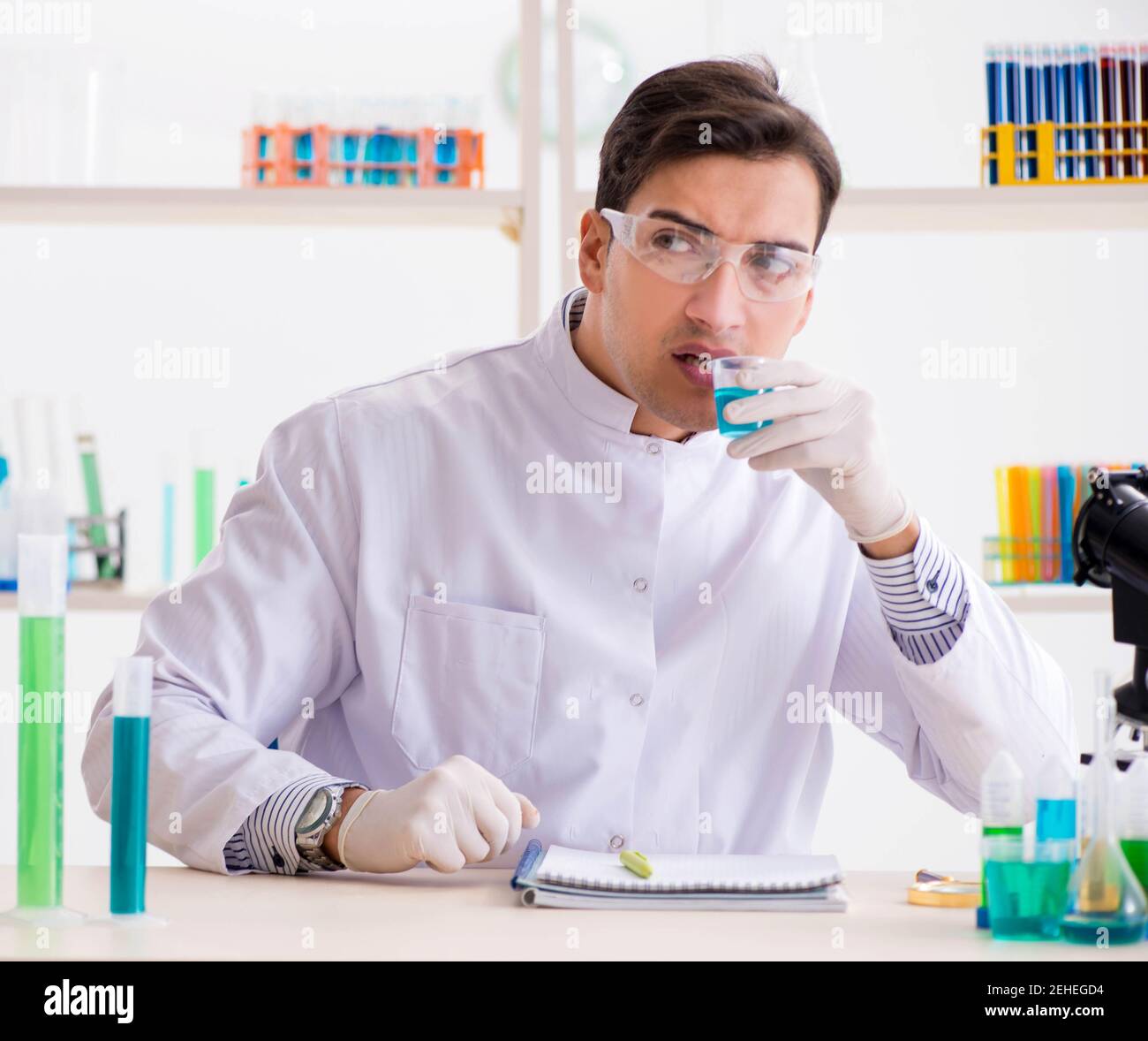 The young chemist student working in lab on chemicals Stock Photo - Alamy
