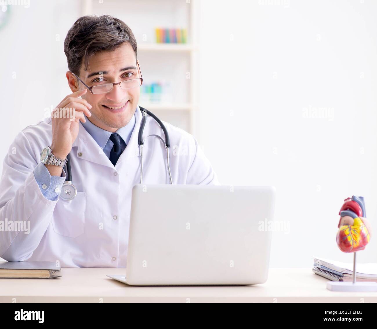 The doctor lecturer explaining the heart model Stock Photo - Alamy