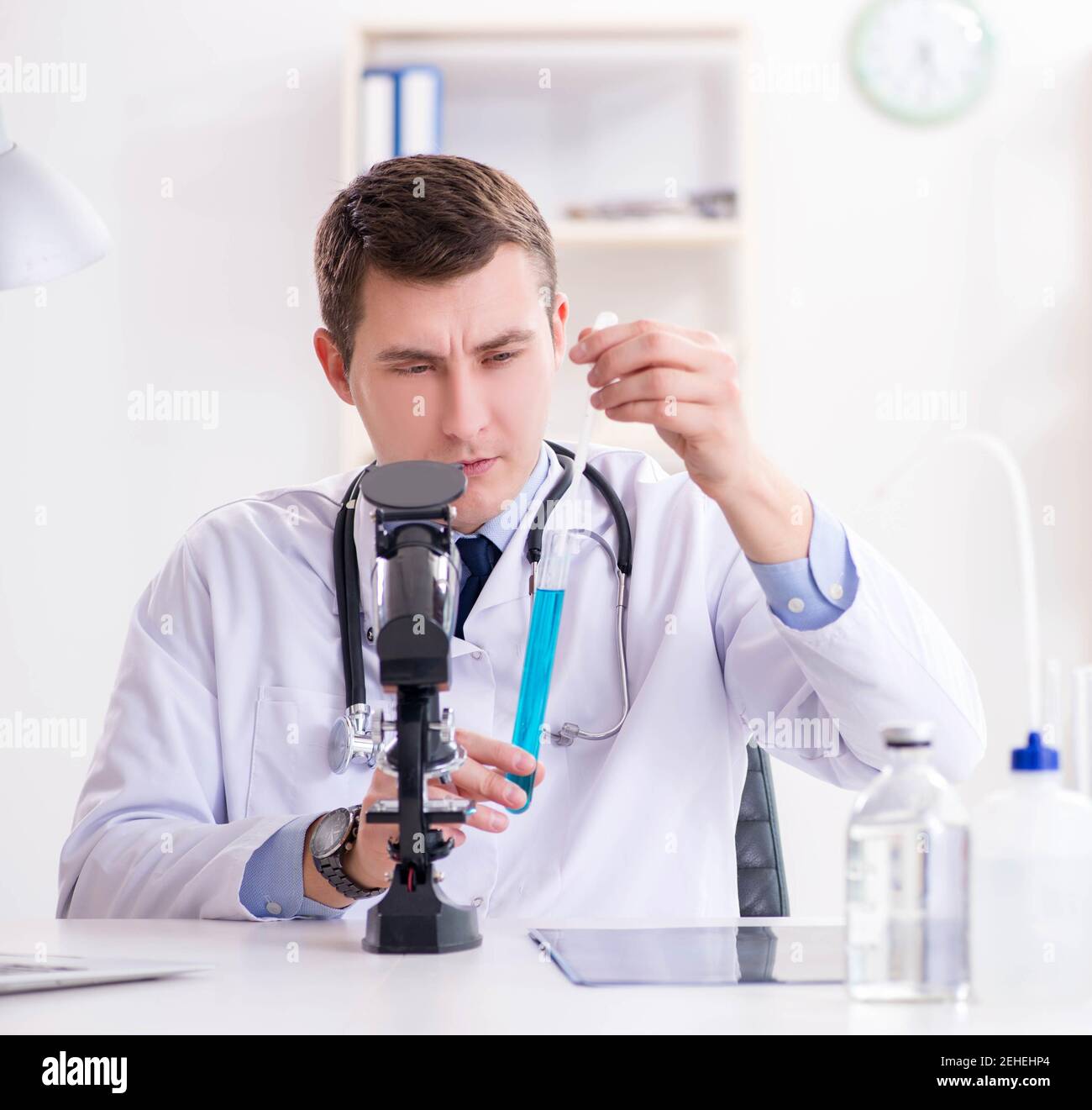 The male doctor looking at lab results in hospital Stock Photo - Alamy