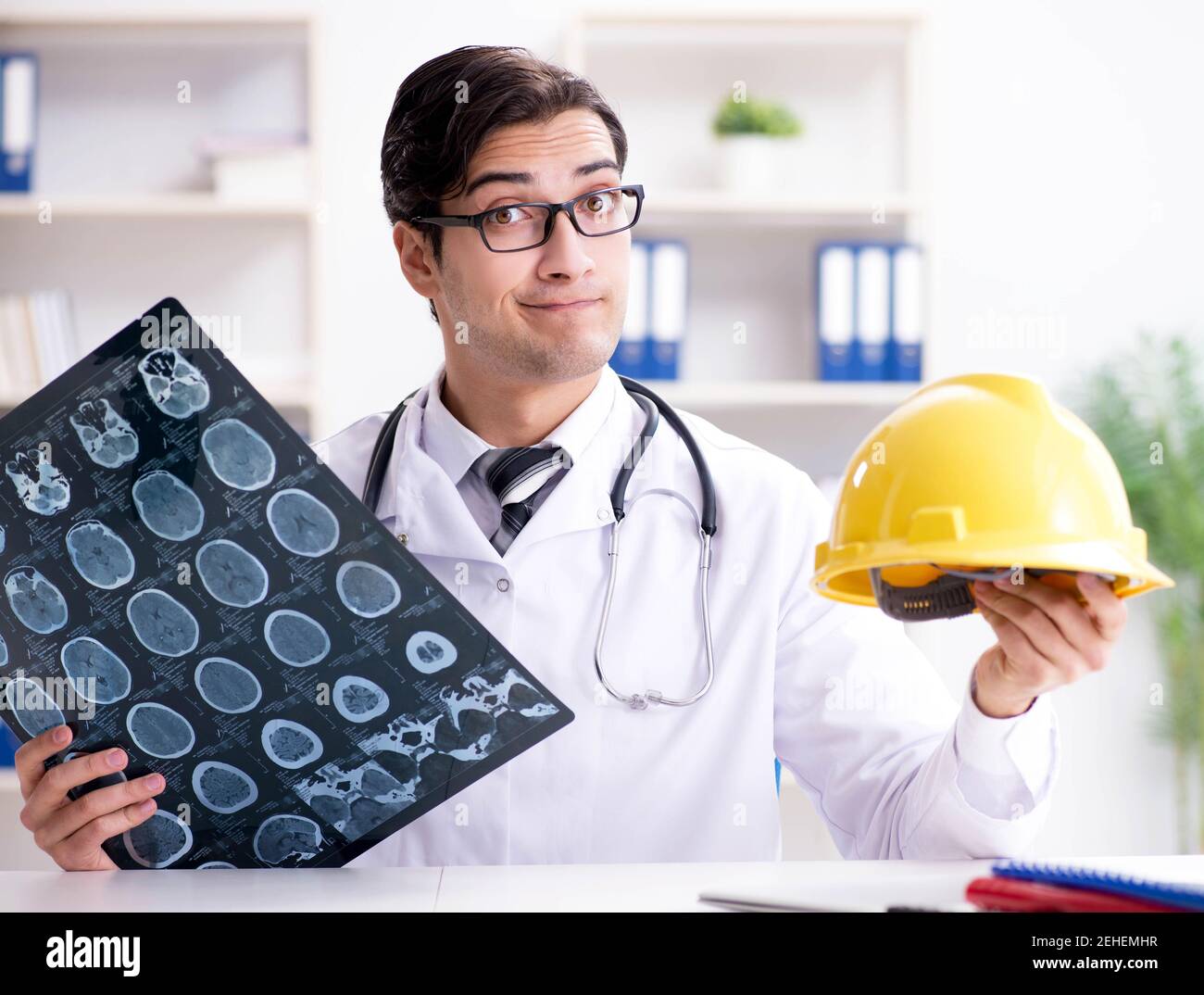 The safety doctor advising about wearing hard hat Stock Photo - Alamy