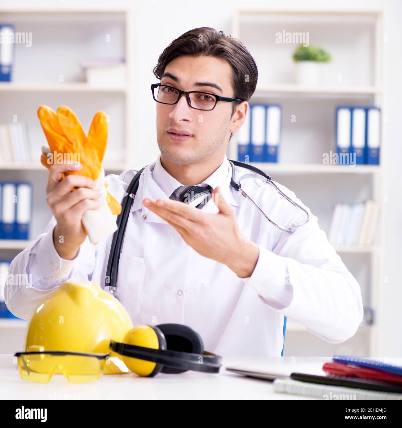 The safety doctor advising about wearing protective gloves Stock Photo ...