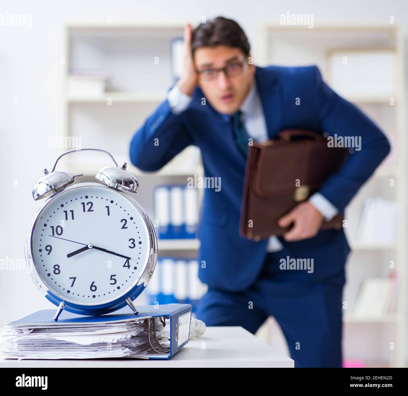 The businessman in bad time management concept Stock Photo - Alamy