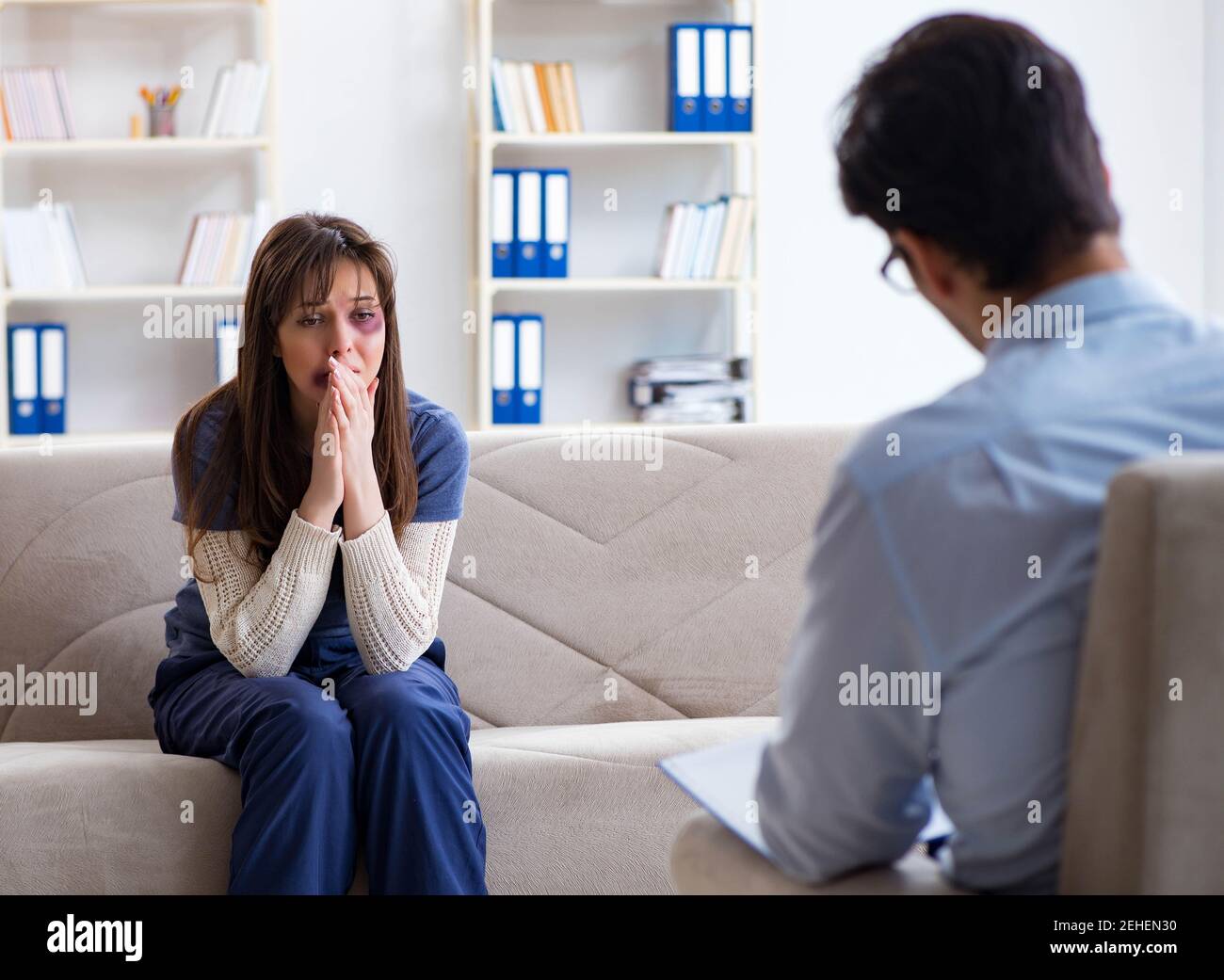 The psychologist counselling woman beaten by husband Stock Photo - Alamy