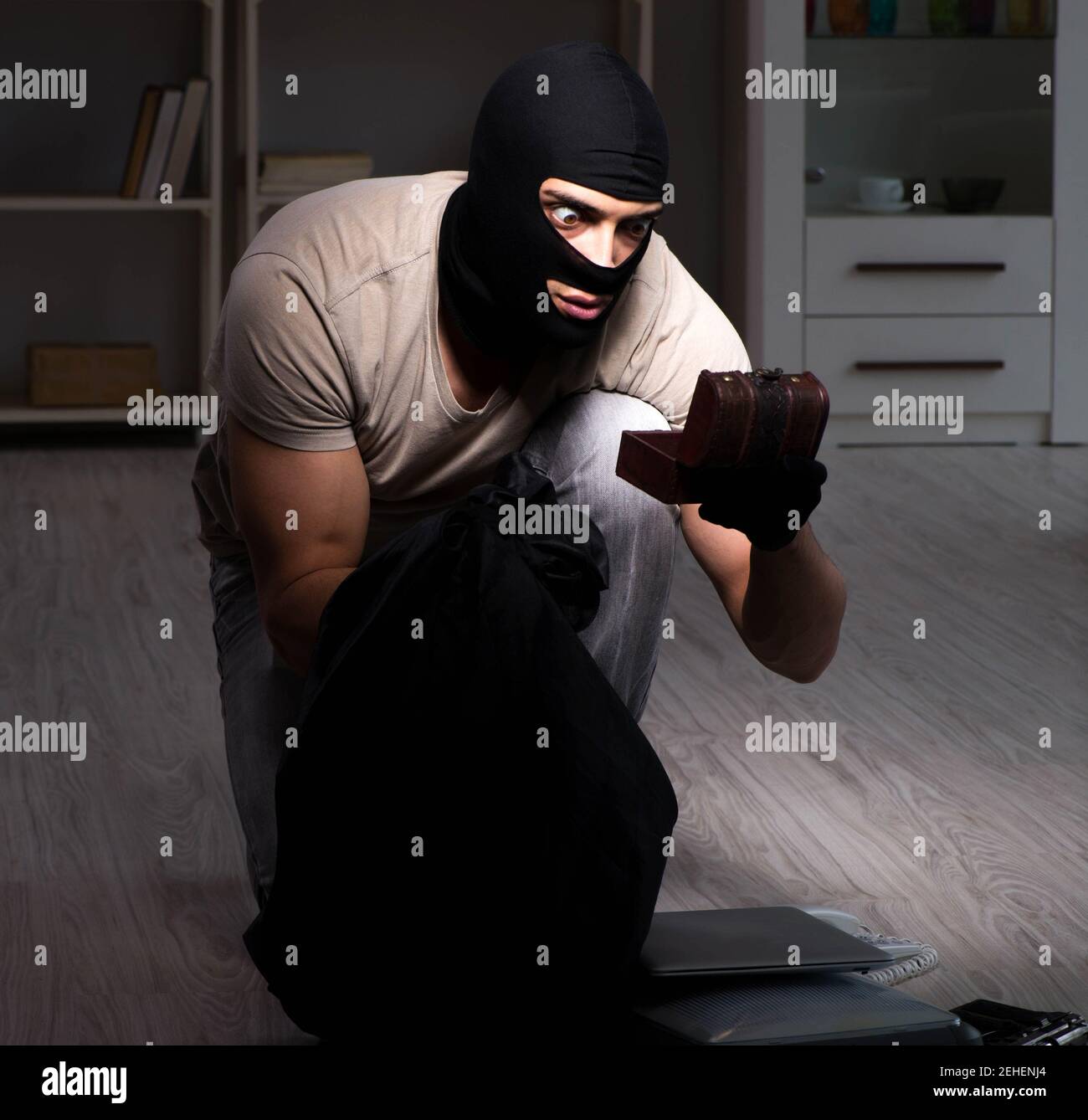 The burglar wearing balaclava mask at crime scene Stock Photo - Alamy