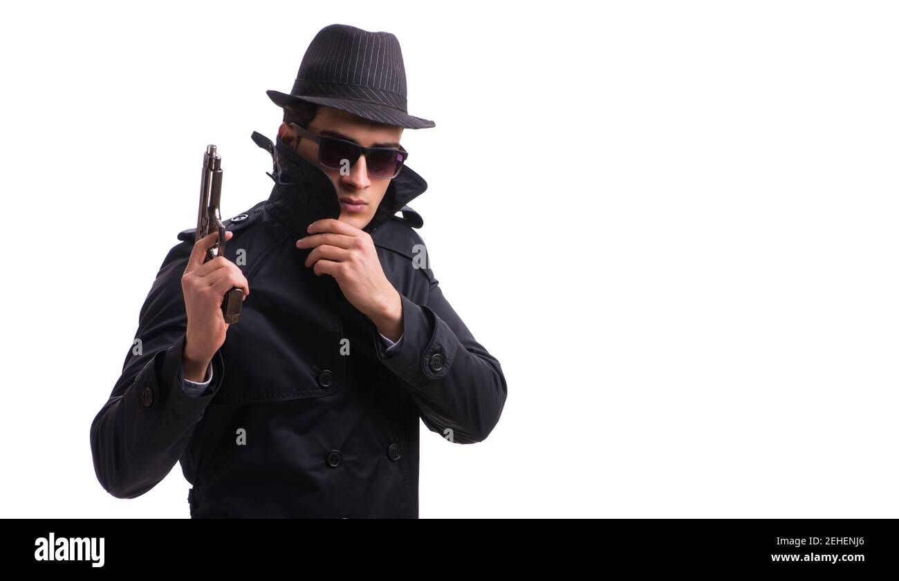 The man spy with handgun isolated on white background Stock Photo - Alamy