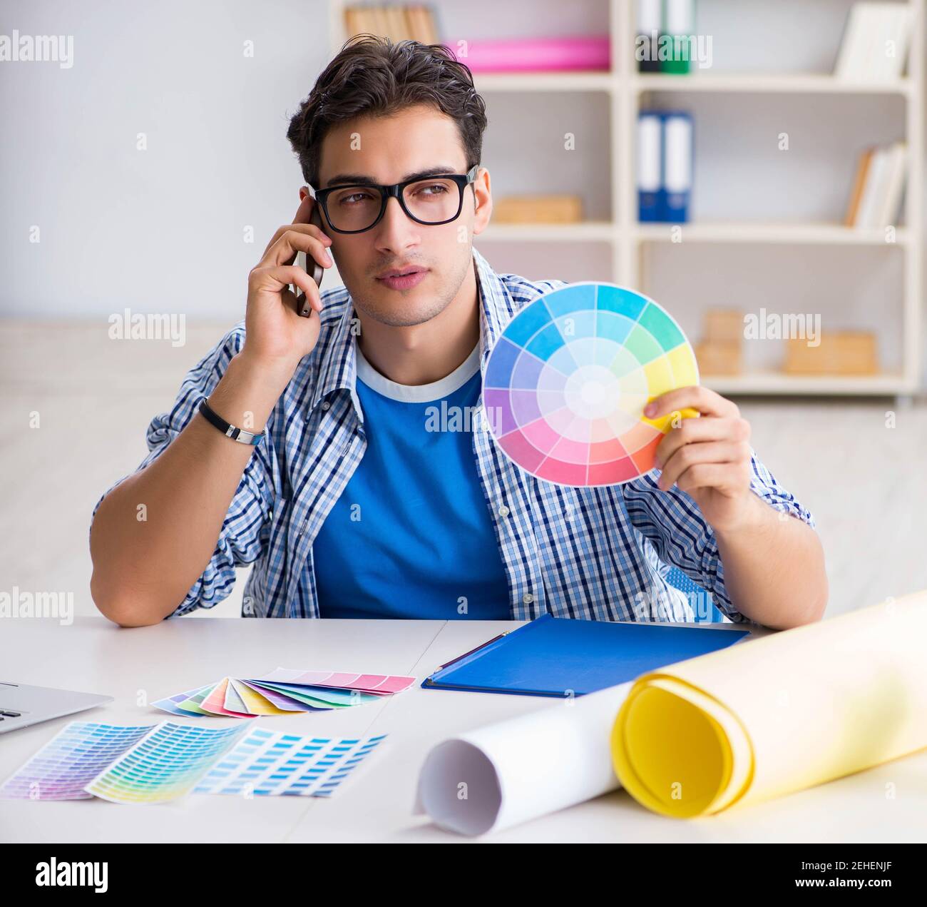 The young designer working on new project and choosing colours Stock ...