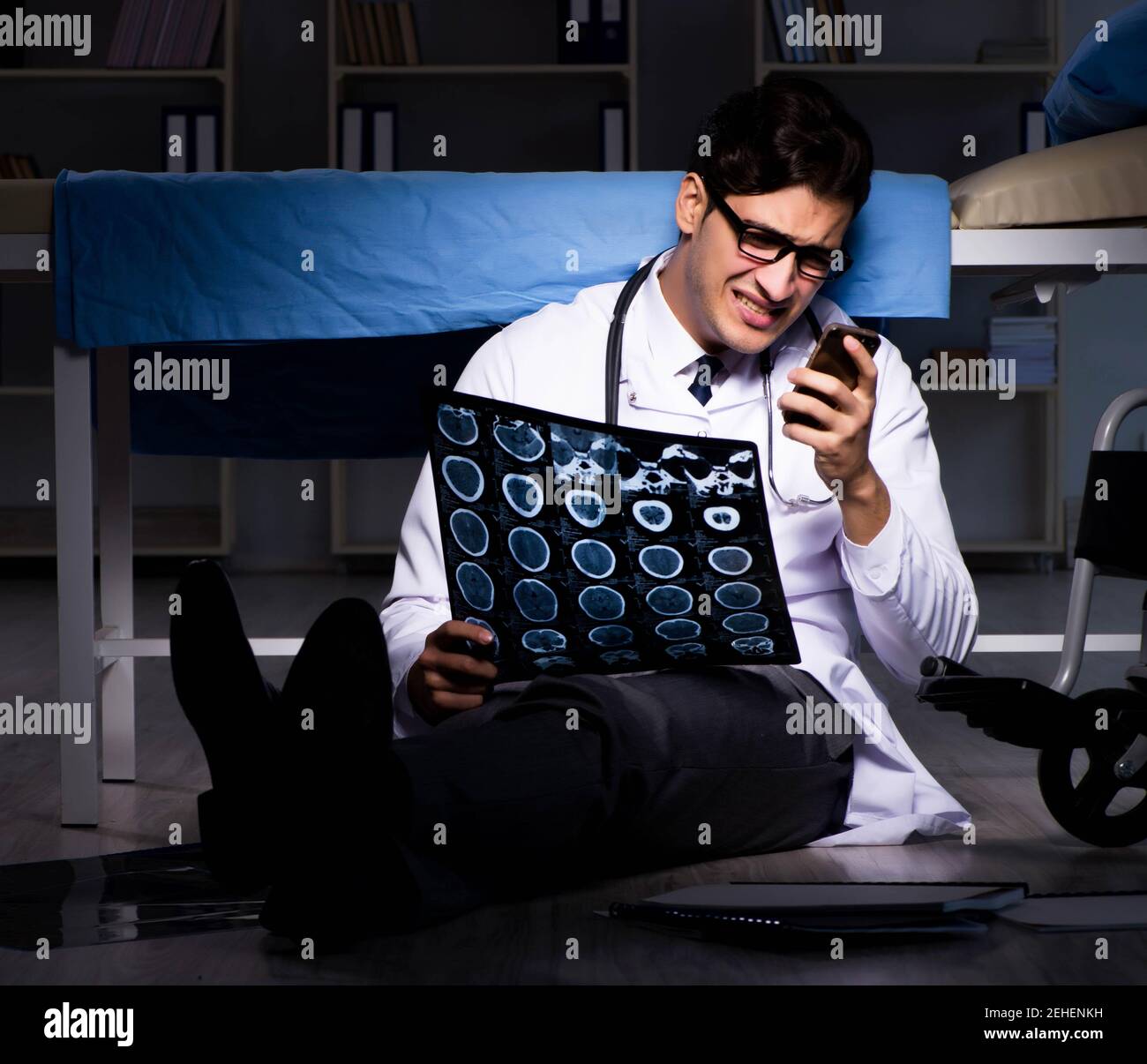 The doctor working night shift in hospital after long hours Stock Photo ...