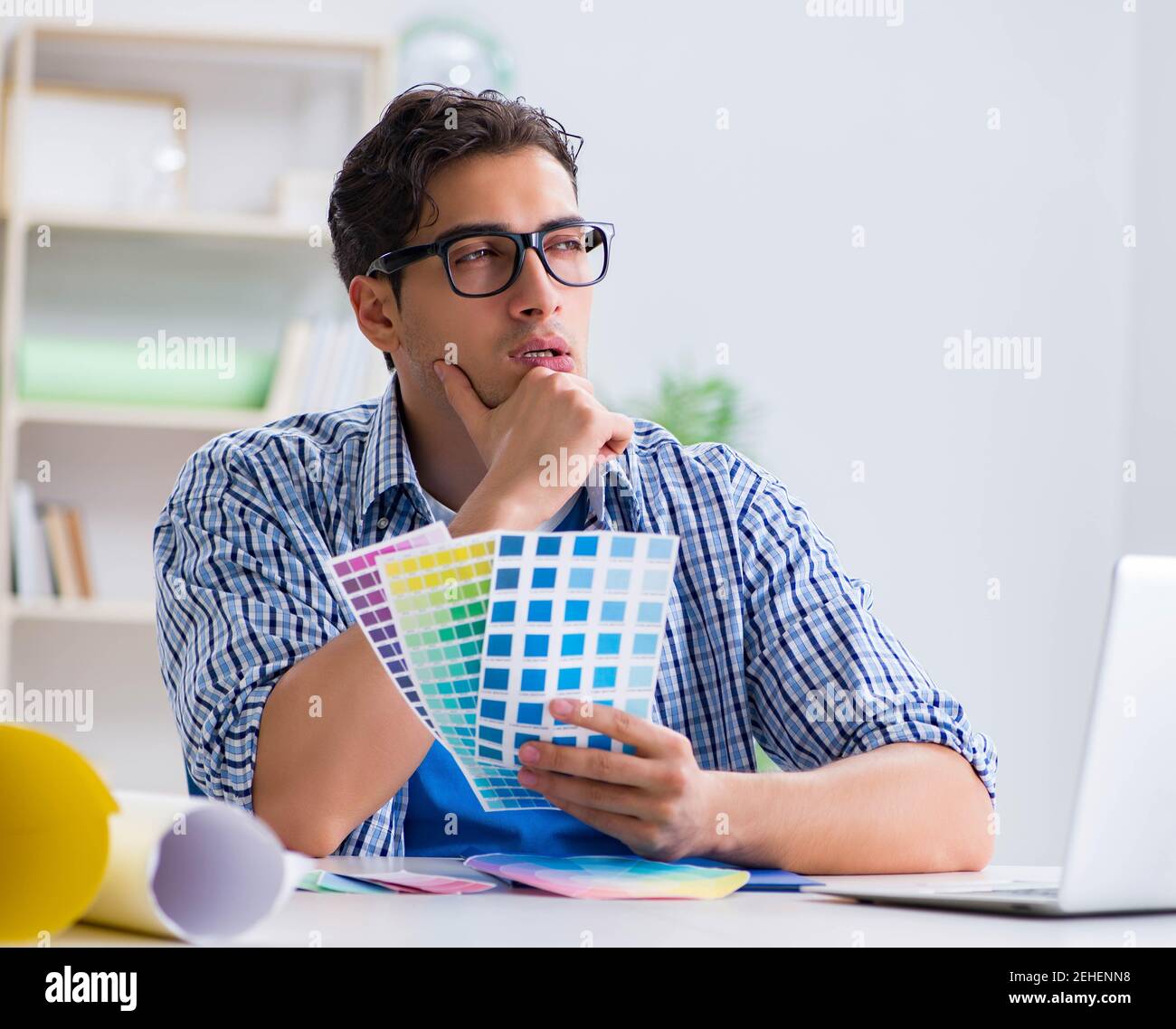 The young designer working on new project and choosing colours Stock ...